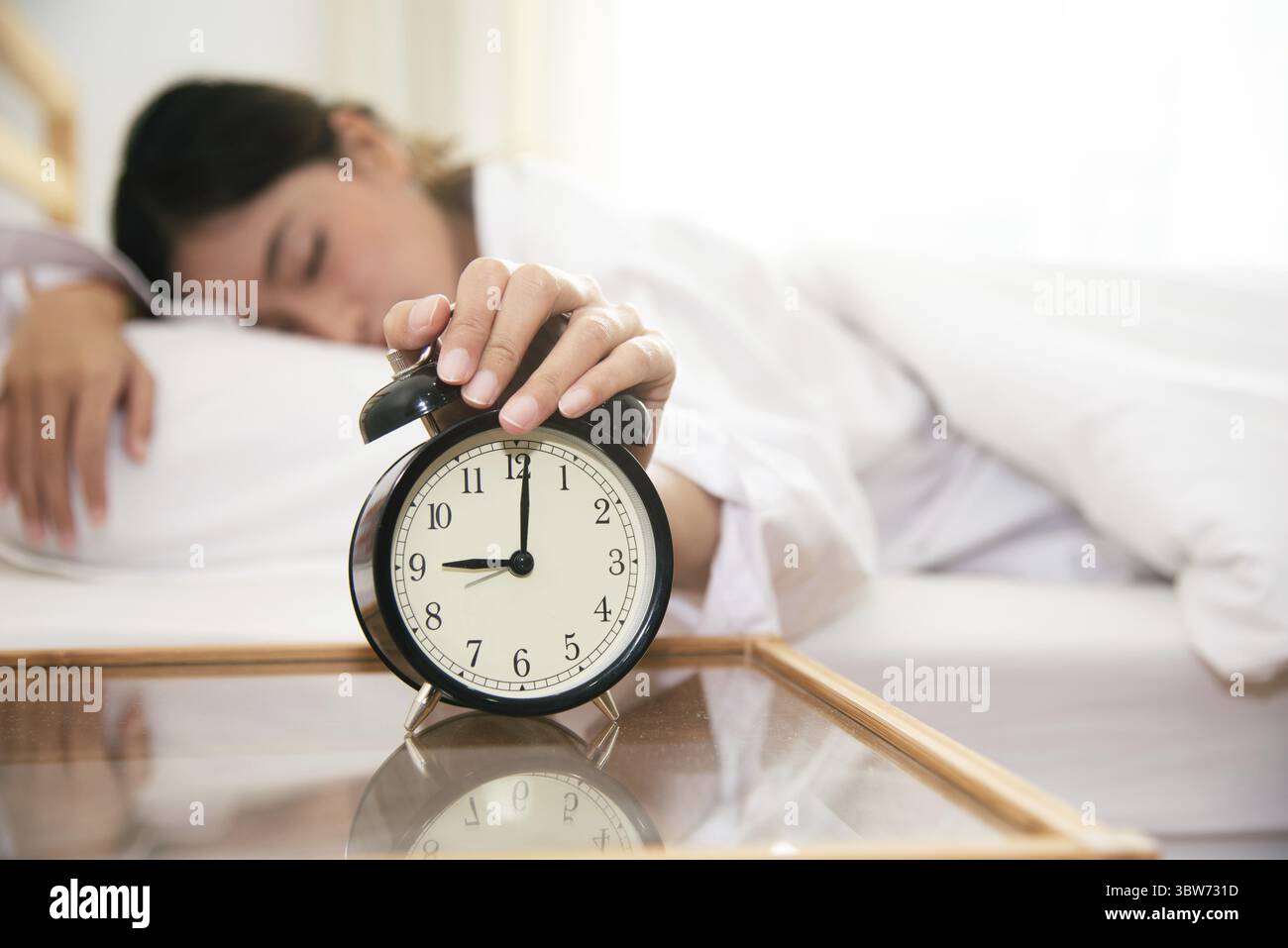 Asian young beauty woman turning off alarm clock in morning late ...