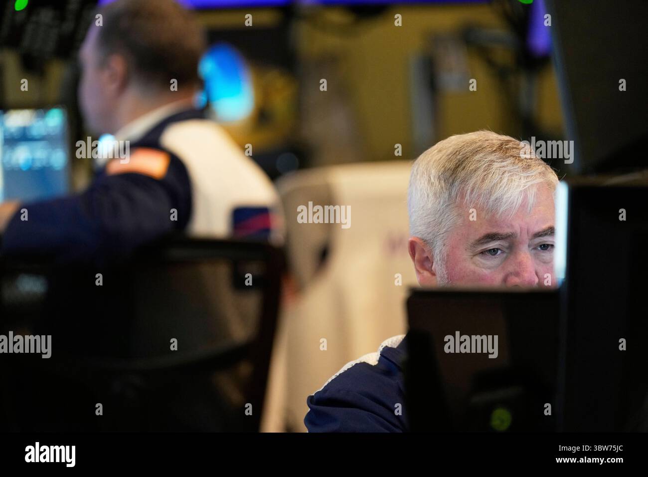 Edward McCarthy works on the floor at the New York Stock Exchange in New York, Wednesday, July ...