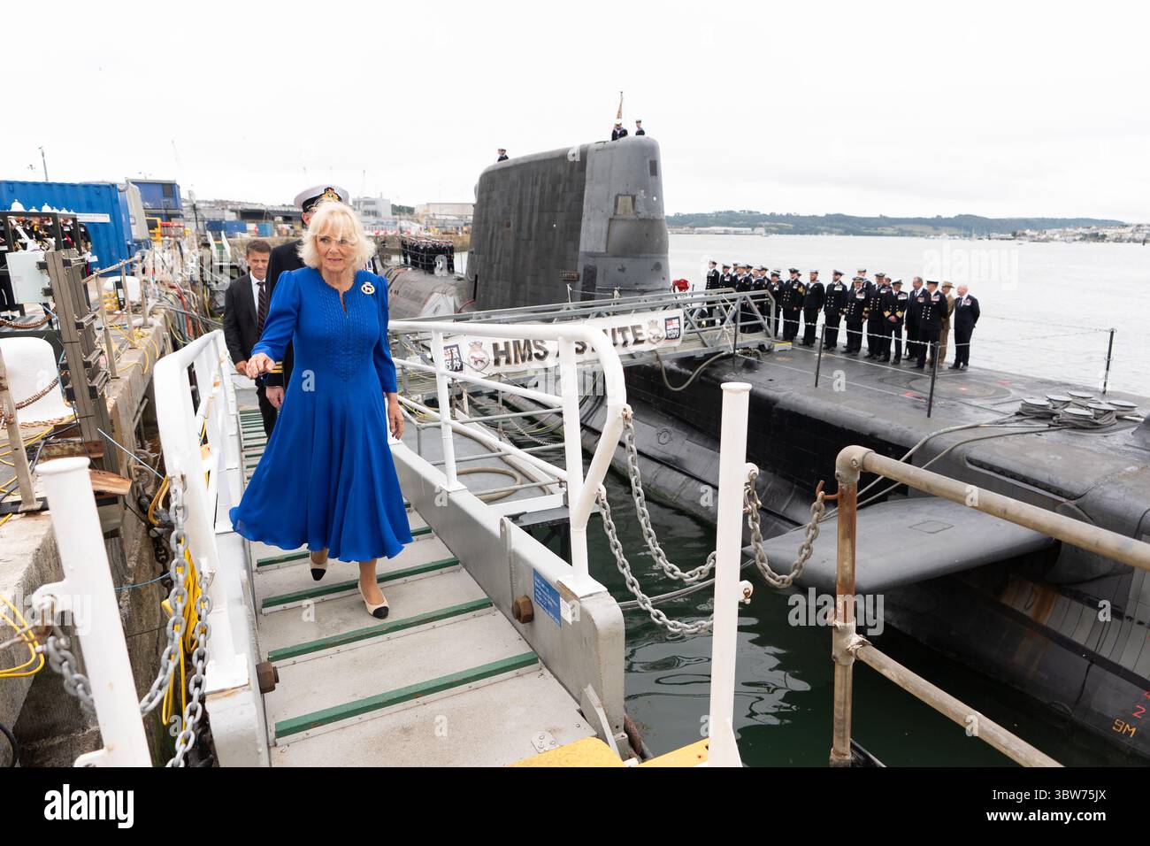 Queen Camilla, Lady Sponsor of the HMS Astute, departs the submarine ...