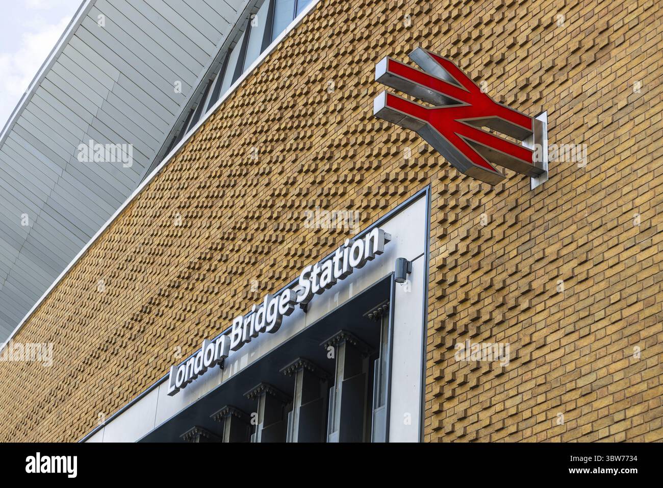 Clear London Bridge Station sign with red British Rail logo on brick ...