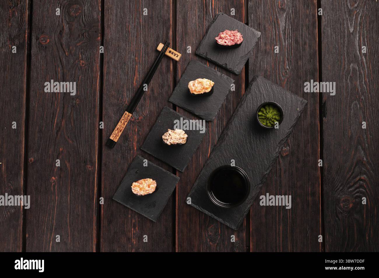 Set of Gunkan Maki Sushi with different types of fish salmon, scallop, perch, eel, shrimp and ...