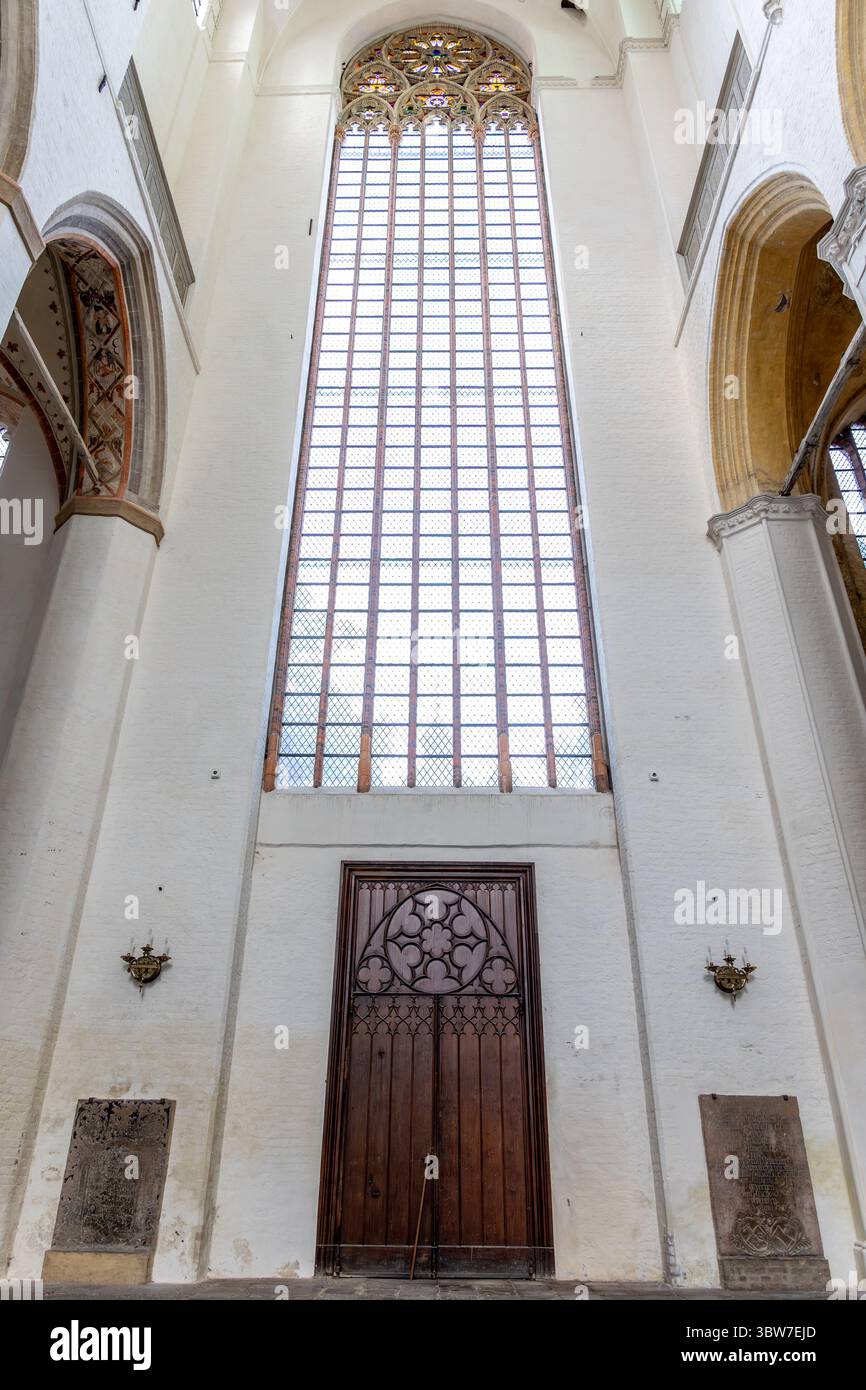 Gothic window. Stained glass. Wooden doors Stock Photo - Alamy