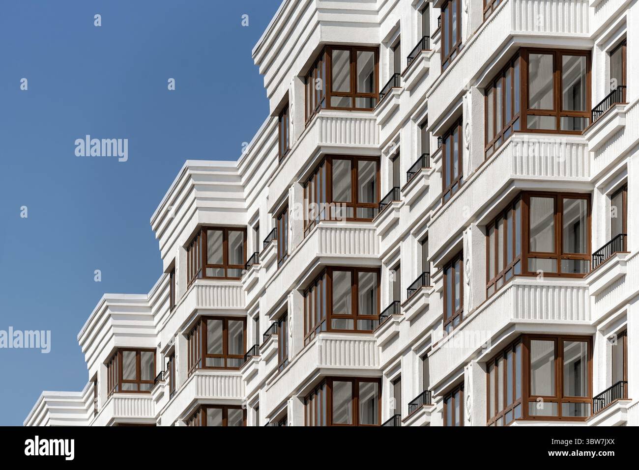 Wall facade and empty windows of new modern houses without people in ...