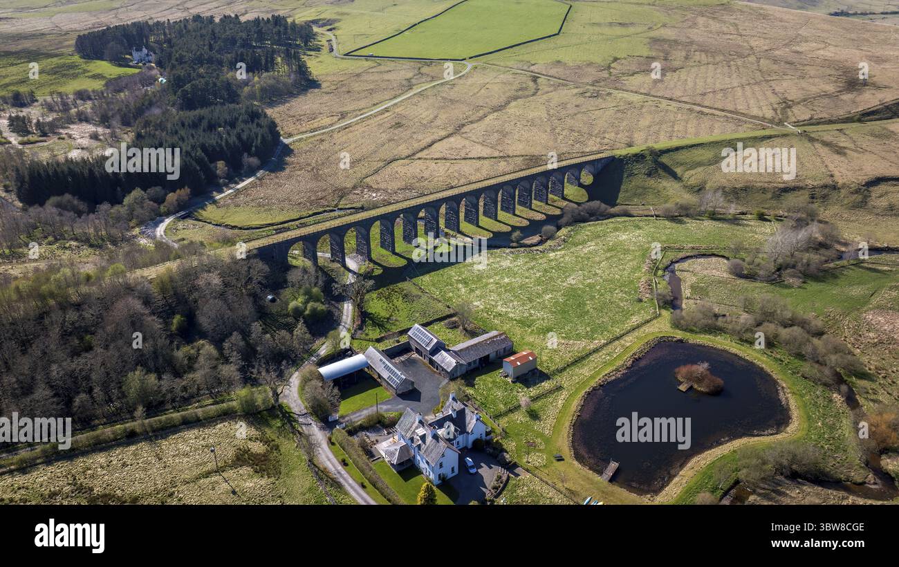 Aerial view of the curving viaduct cutting through the rolling green ...