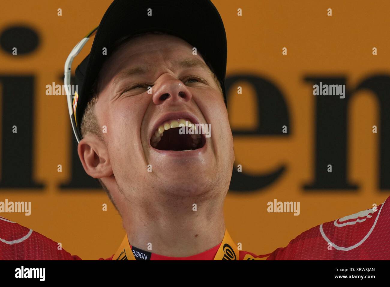 Norway's Jonas Abrahamsen celebrates on the podium after winning the ...