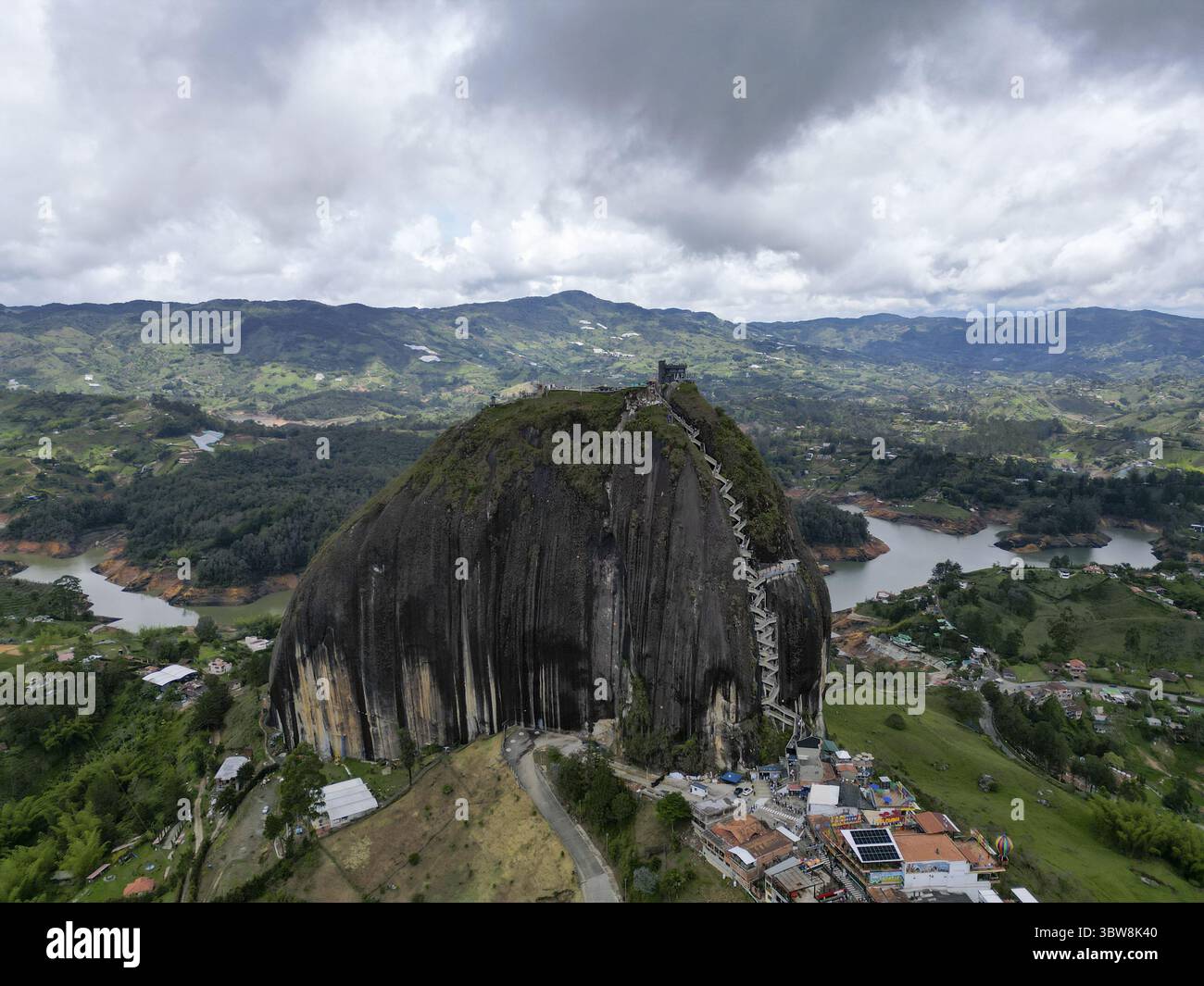 Aerial view of El Peñol, a colossal rock formation with a winding ...