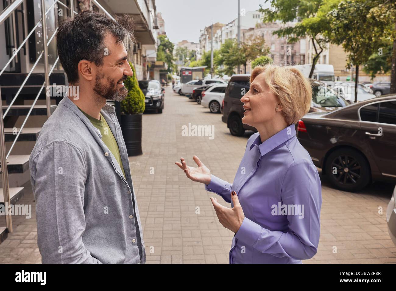 Lively discussion occurs outside as adult male with a hearing aid ...