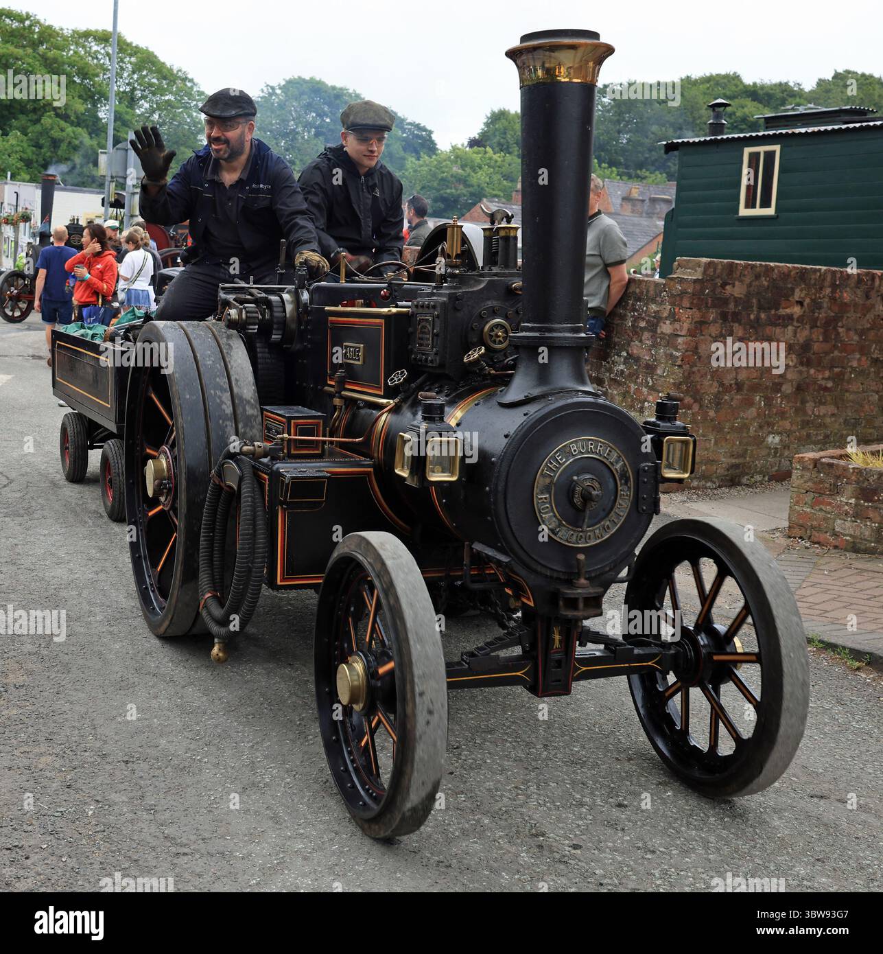The crew of this scale replica of a Burrell steam road locomotive look ...