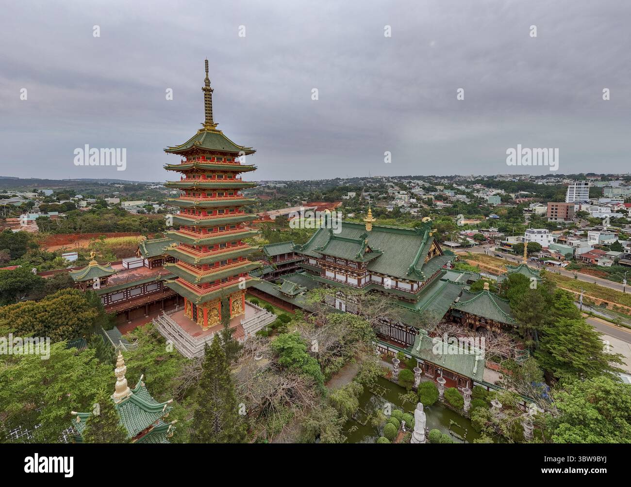Aerial view of Minh Thanh Pagoda's majestic tower piercing the skyline ...