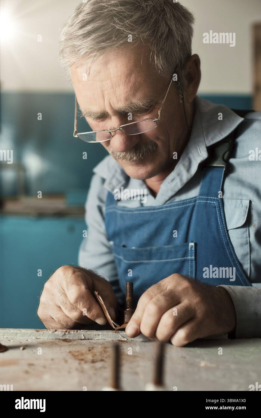 Male mechanic in glasses carefully hi-res stock photography and images ...