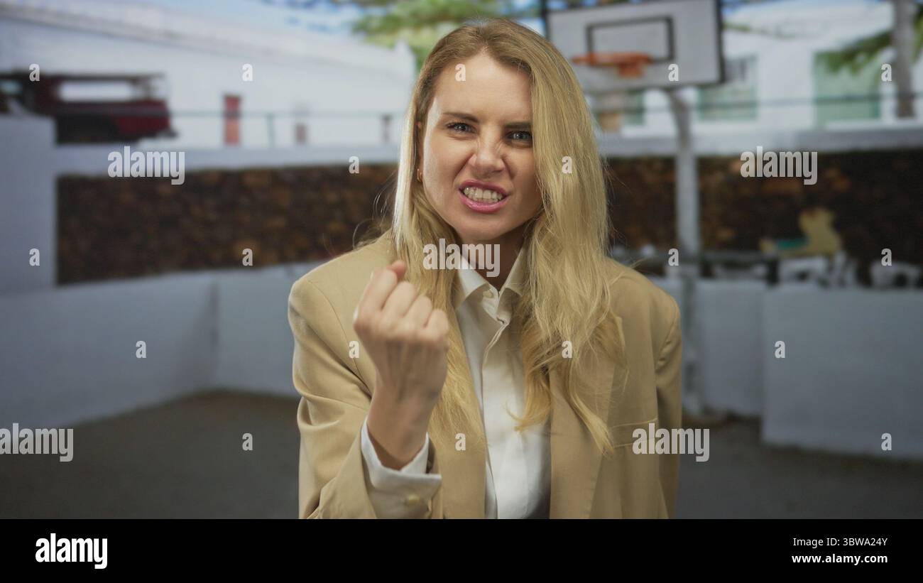 Woman expressing anger on outdoor basketball court emphasizes emotion ...