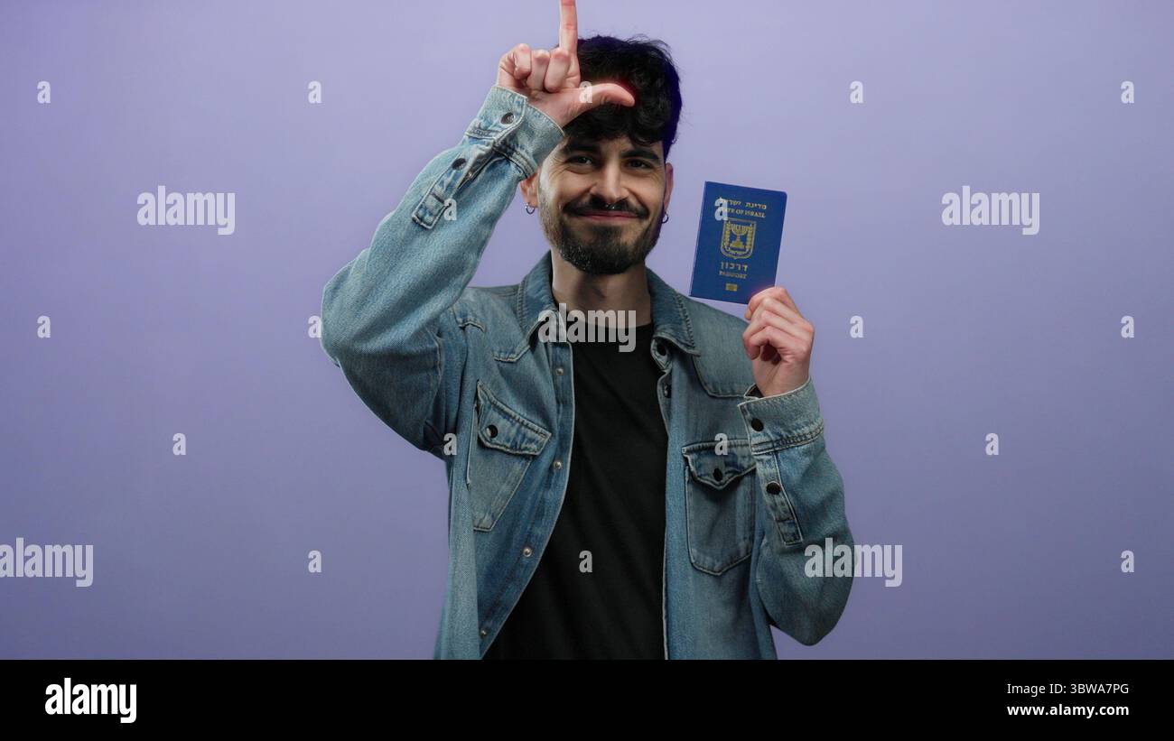 Man smiling holding israeli passport against purple background wearing ...