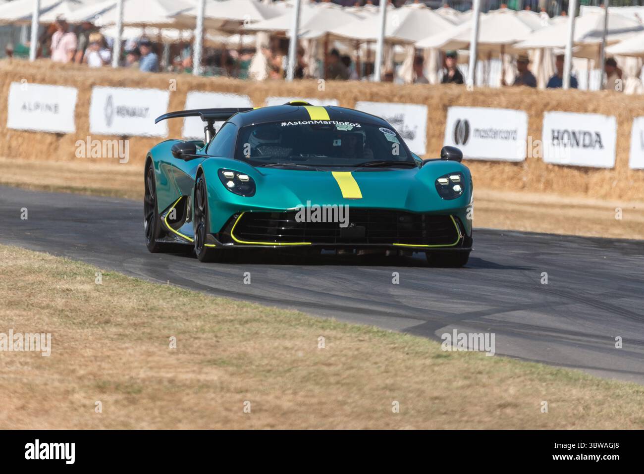 Aston Martin Valhalla sports car driving up hillclimb track at Goodwood ...