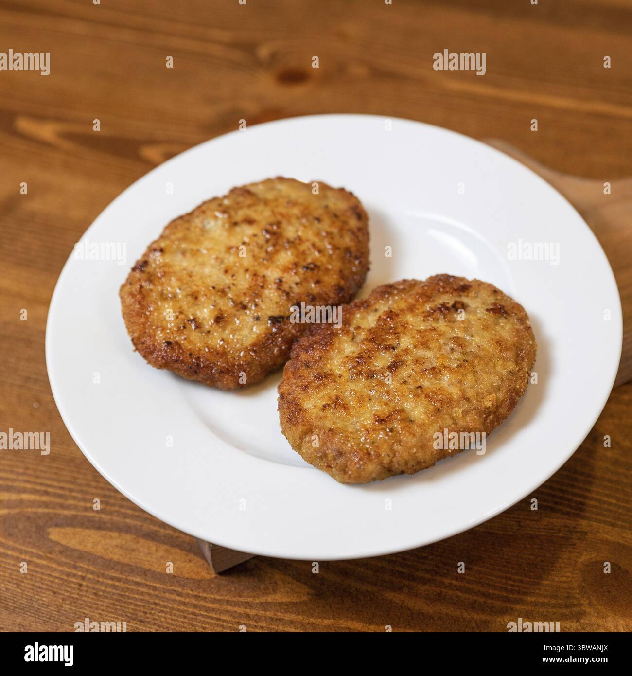Chicken cutlet on the plate close up Stock Photo - Alamy