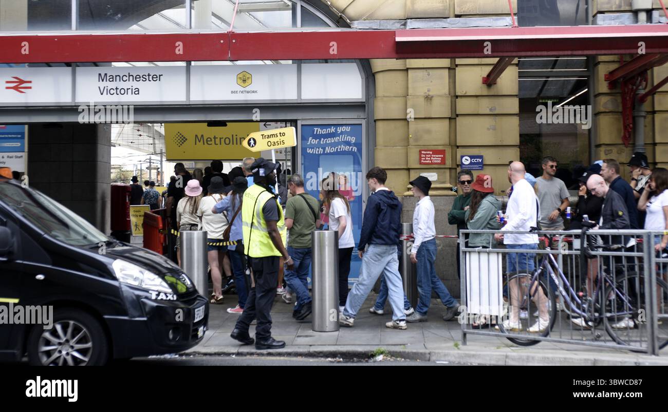 Manchester, UK, 16th July, 2025 Eager Oasis fans queue at Victoria ...