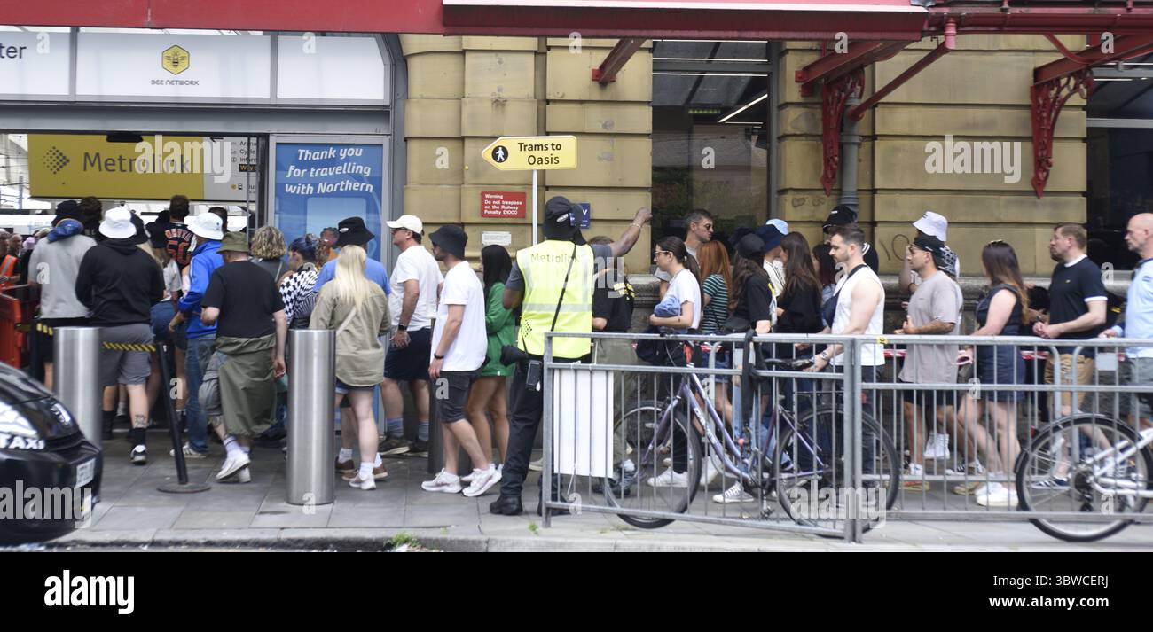 Manchester, UK, 16th July, 2025 Eager Oasis fans queue at Victoria ...