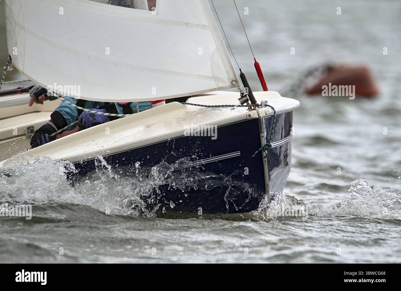 Bow Of A Gul Sailing Dinghy Splashing Through The Waves On A Windy Day ...