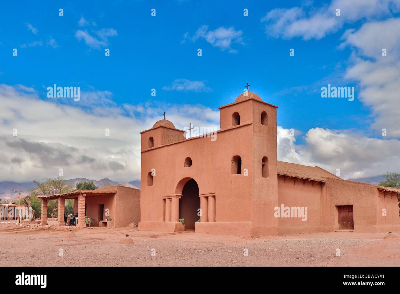 Colonial adobe building with bell towers and arches at the Rosary ...