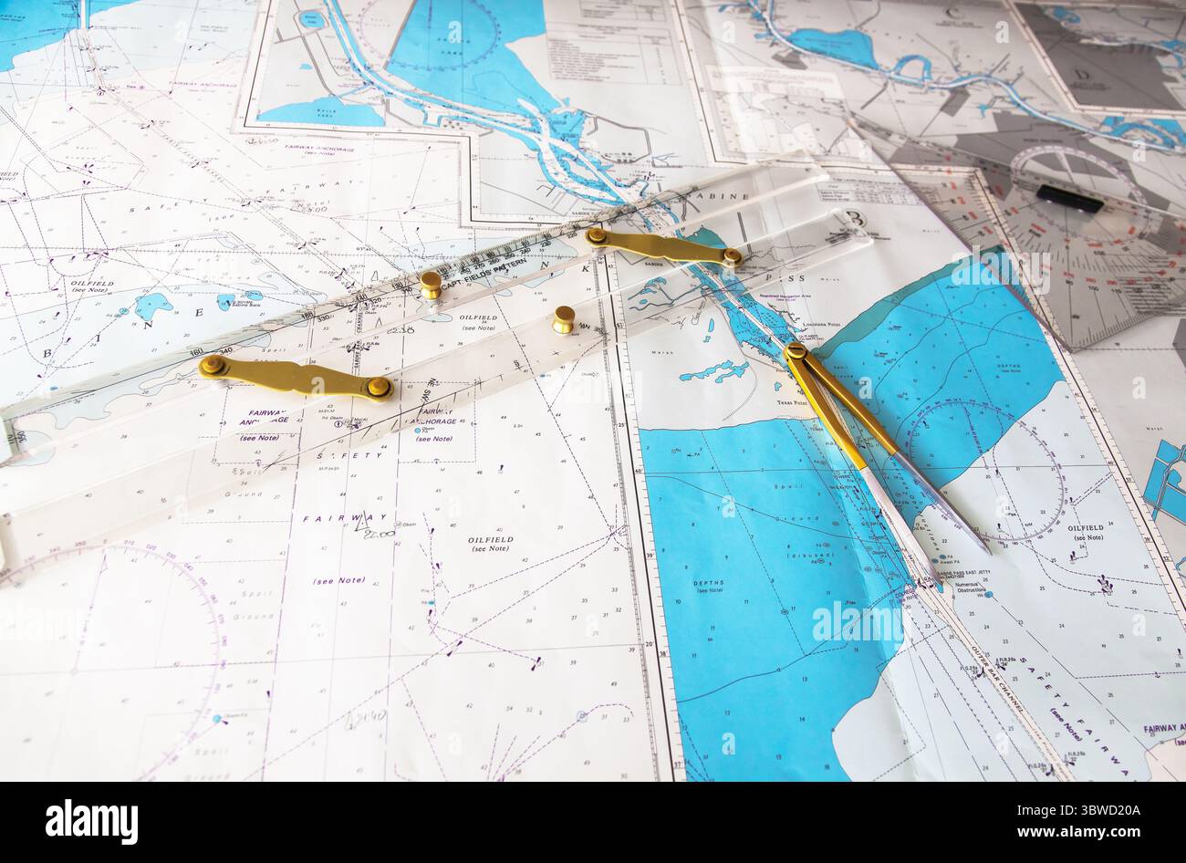 Maps of the ship for plotting. Plotter, divider and ruler. Close-up ...
