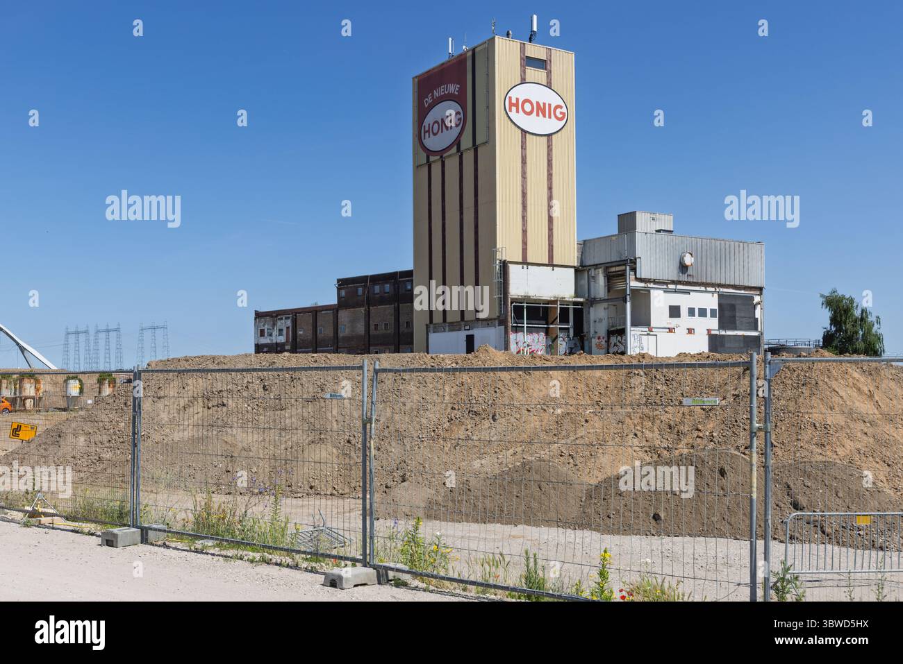Tall former factory building with "HONIG" signs overlooking a ...