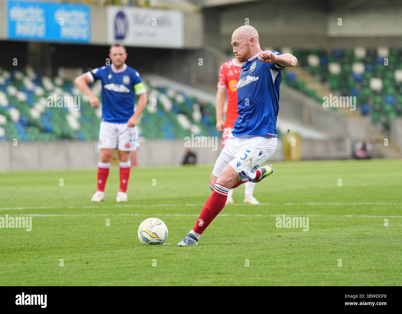 Linfield's Chris Shields scores a penalty during the UEFA Champions ...