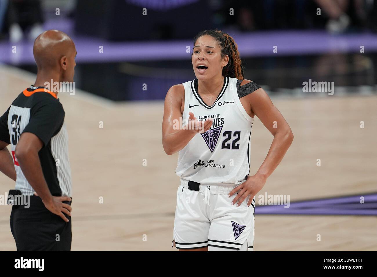 Golden State Valkyries guard Veronica Burton (22) talks with referee Biniam Maru during the ...
