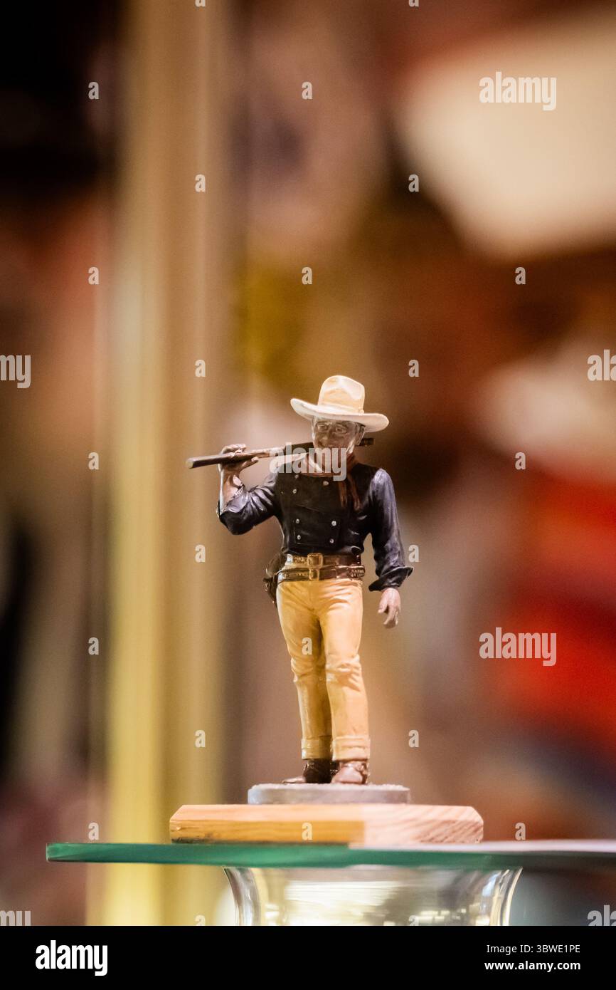 16 July 2025, Berlin: A figurine of US actor John Wayne stands in a ...