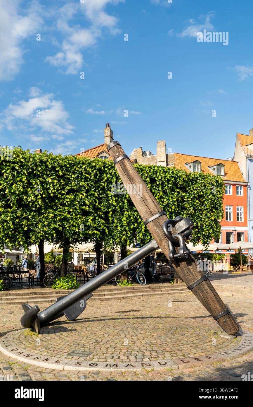 Vertical shot historic Memorial Anchor in vibrant Nyhavn Copenhagen ...