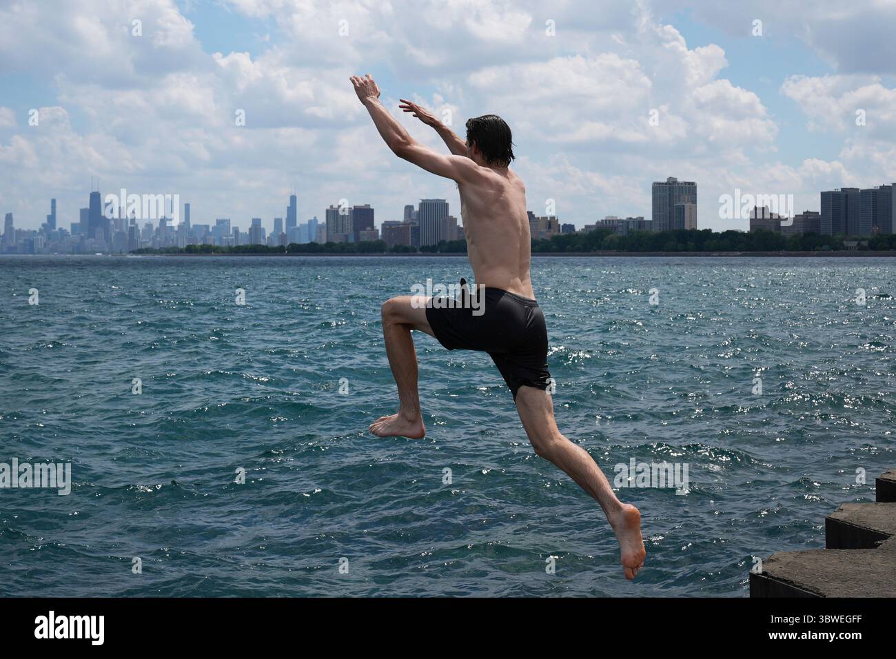 Carson Harvey jumps into Michigan Lake at Montrose Beach, Wednesday ...