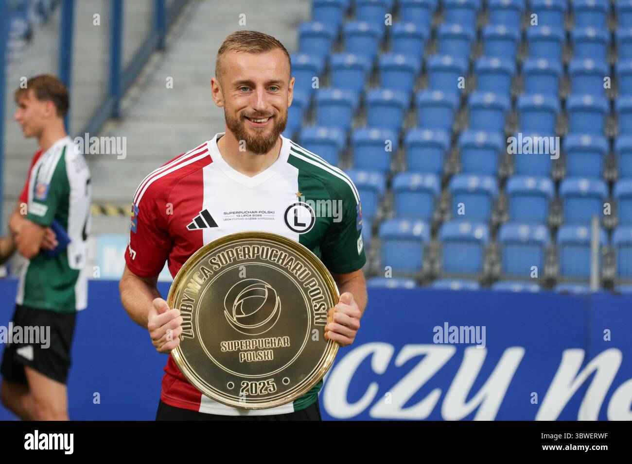 Rafal Augustyniak of Legia Warszawa holds the trophy at the ceremony ...
