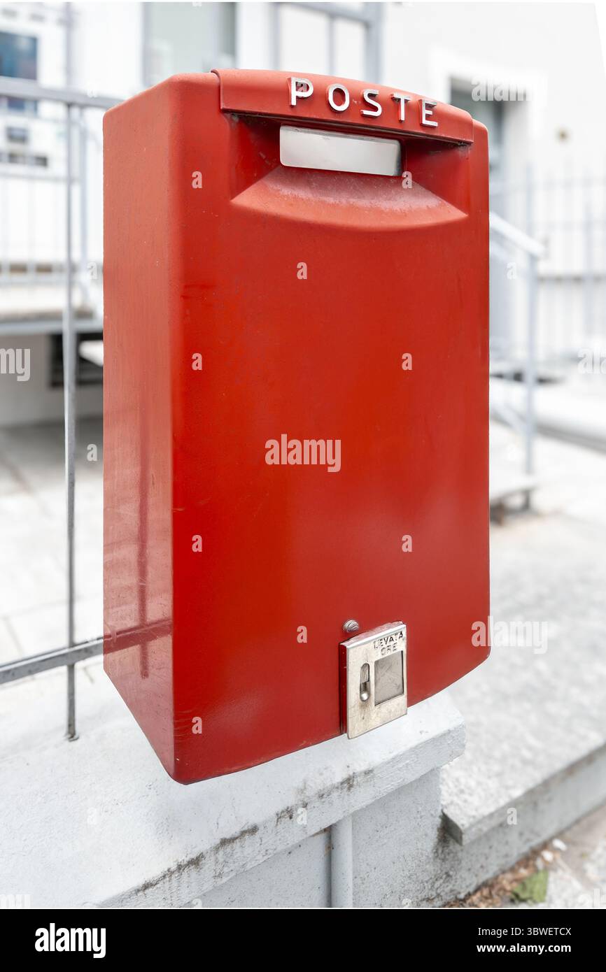Red Italian Poste mail collection box on railing Stock Photo - Alamy