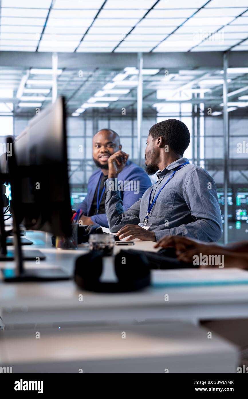 Engineering team looking components hi-res stock photography and images ...