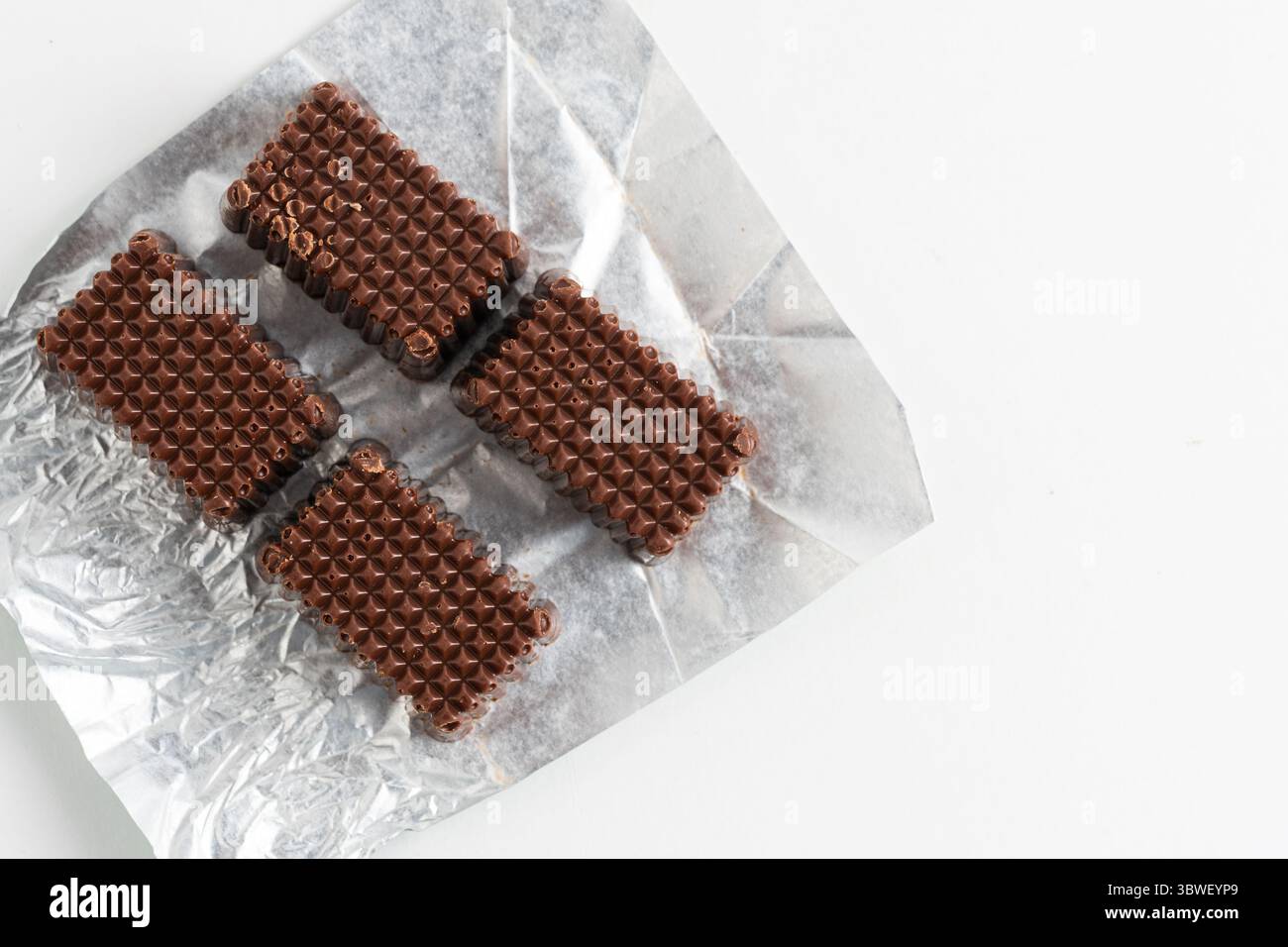 Chocolates in package on white background Stock Photo - Alamy