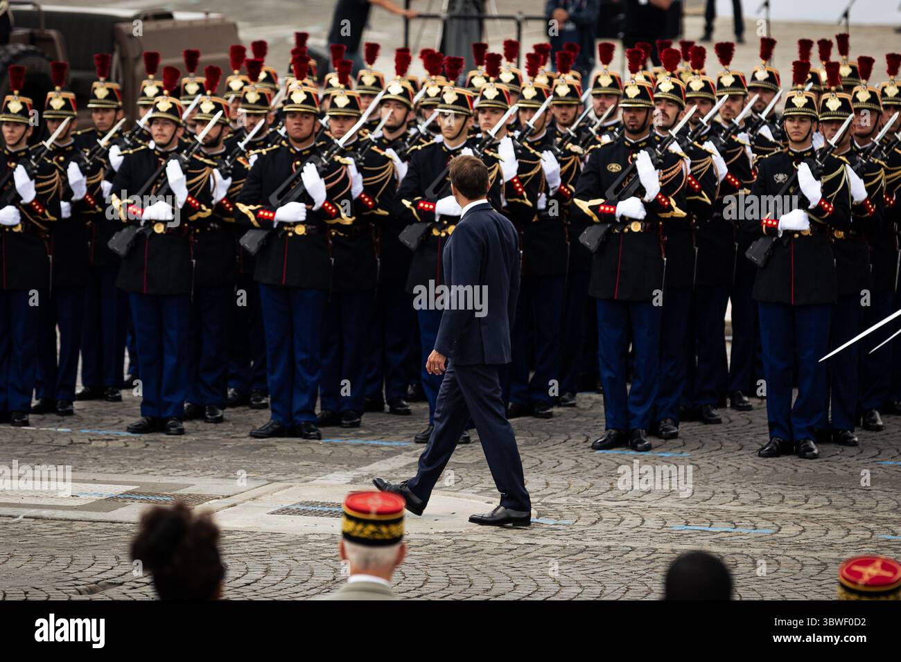 French President Emmanuel Macron walks past the France's 1er Regiment d ...