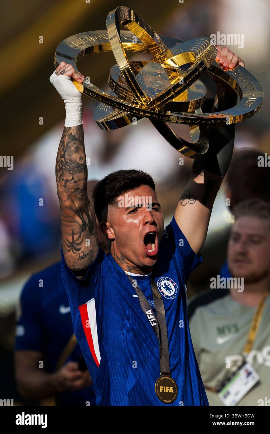 Enzo Fernandez of Chelsea FC lifts the trophy during the award ceremony ...