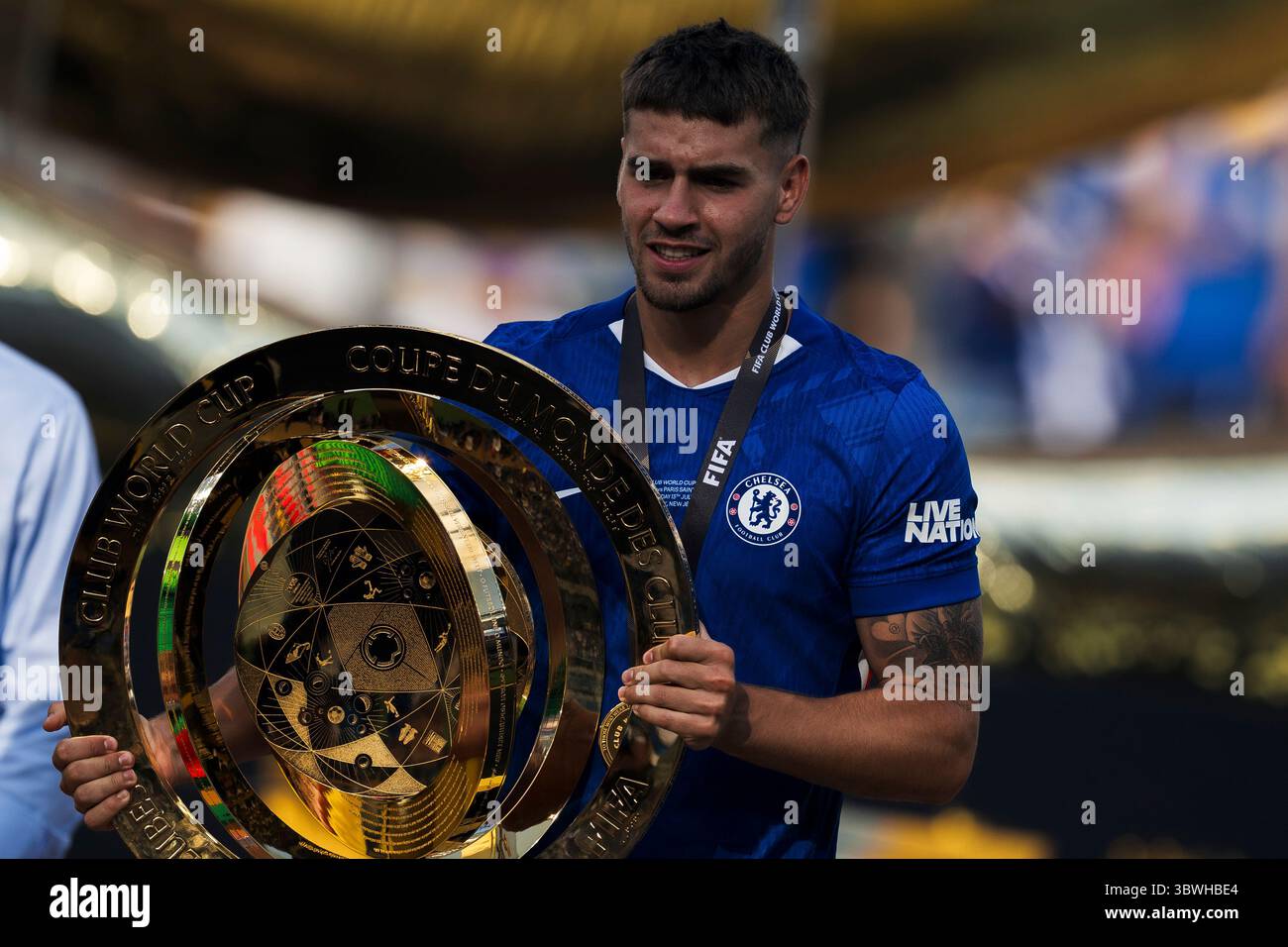 Marc Guiu of Chelsea FC poses with the trophy during the award ceremony ...