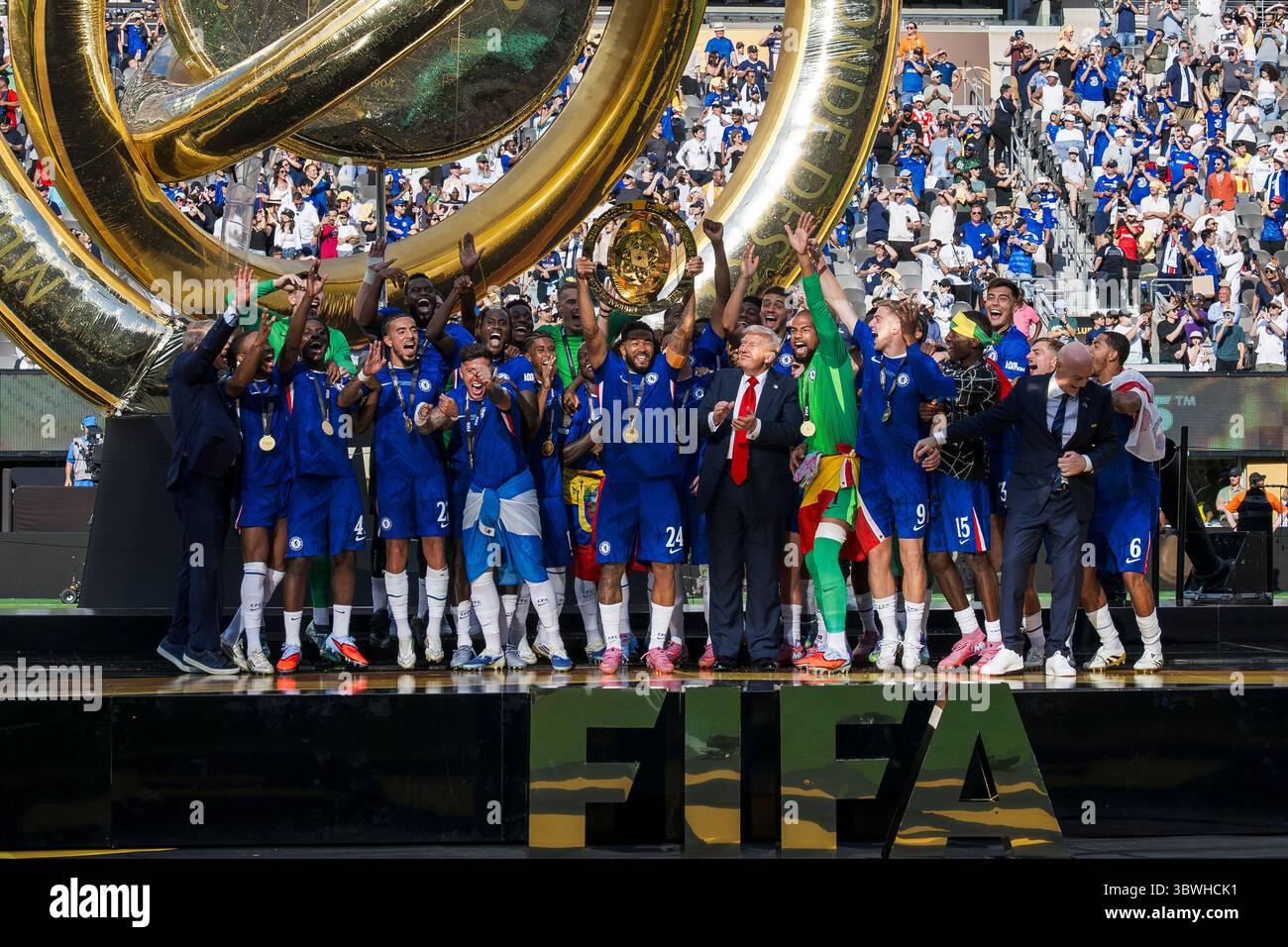 Reece James of Chelsea FC lifts the trophy as his teammates celebrate ...