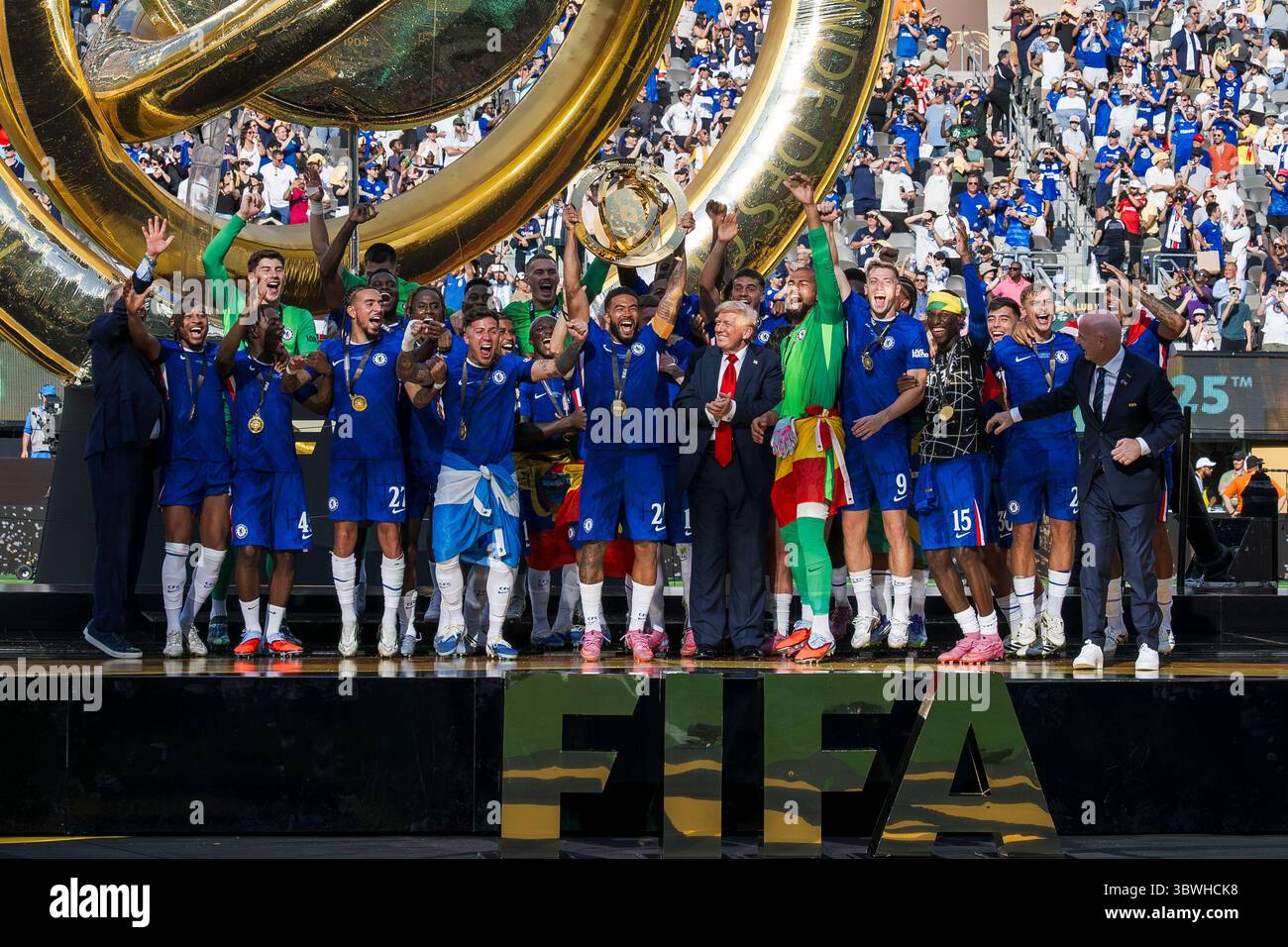 Reece James of Chelsea FC lifts the trophy as his teammates celebrate ...