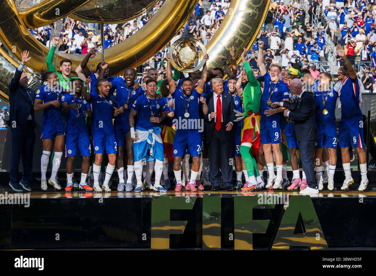 Reece James of Chelsea FC lifts the trophy as his teammates celebrate ...