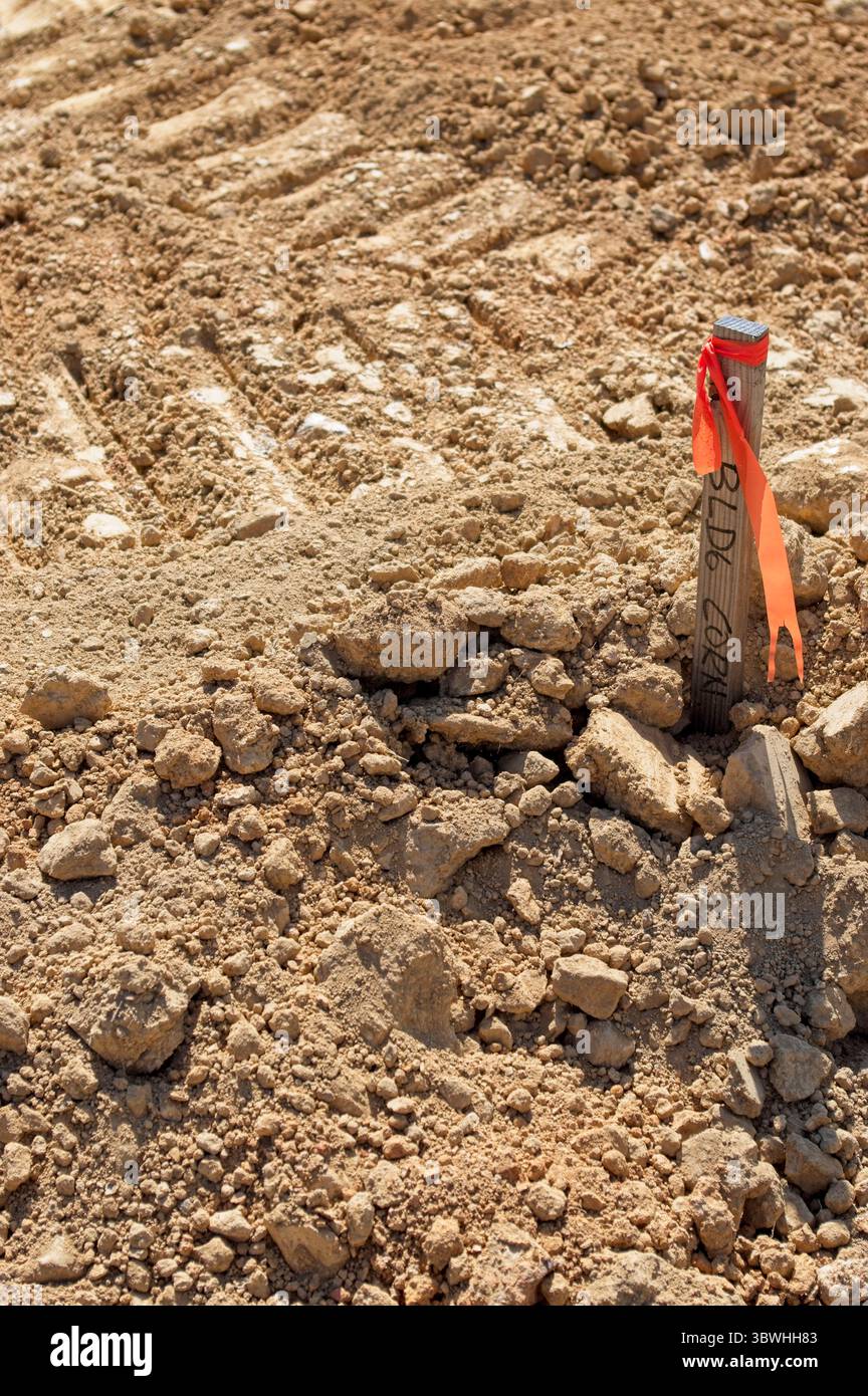 Stake and flag for corner of building at a construction site Stock ...