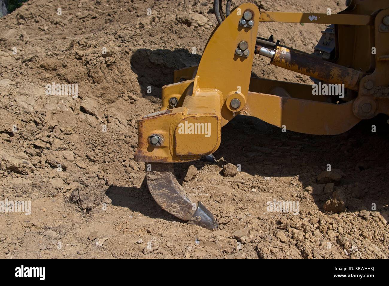 Earth ripper tooth sitting on dirt Stock Photo - Alamy