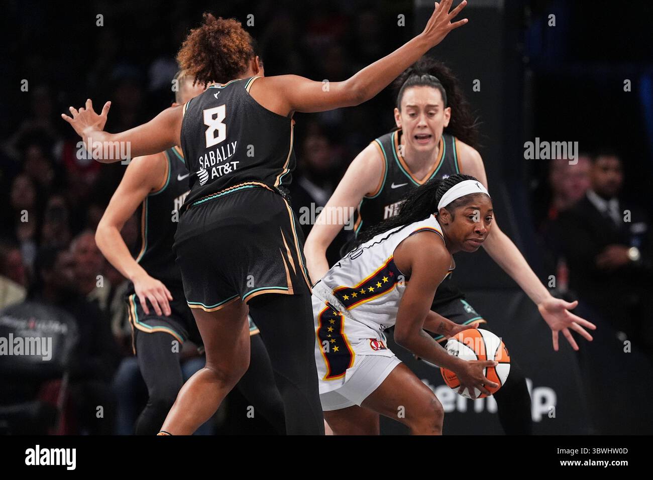 Indiana Fever's Aari McDonald, center, looks to pass away from New York ...