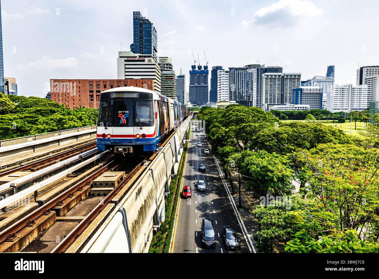 A BTS Skytrain travels through central Bangkok, Thailand, elevated ...