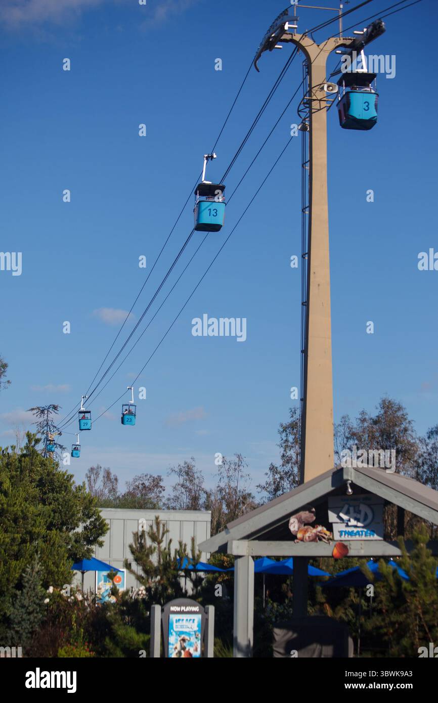 A Tourist inside a cable car with a bird painting in San Diego Zoo, San ...