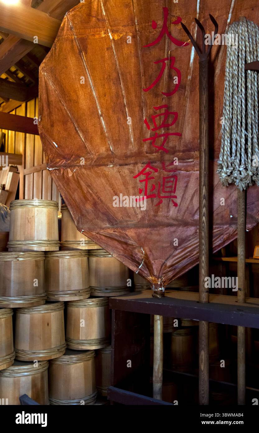 Historic fire fighting gear including fire buckets, a "hi no yo jin ...