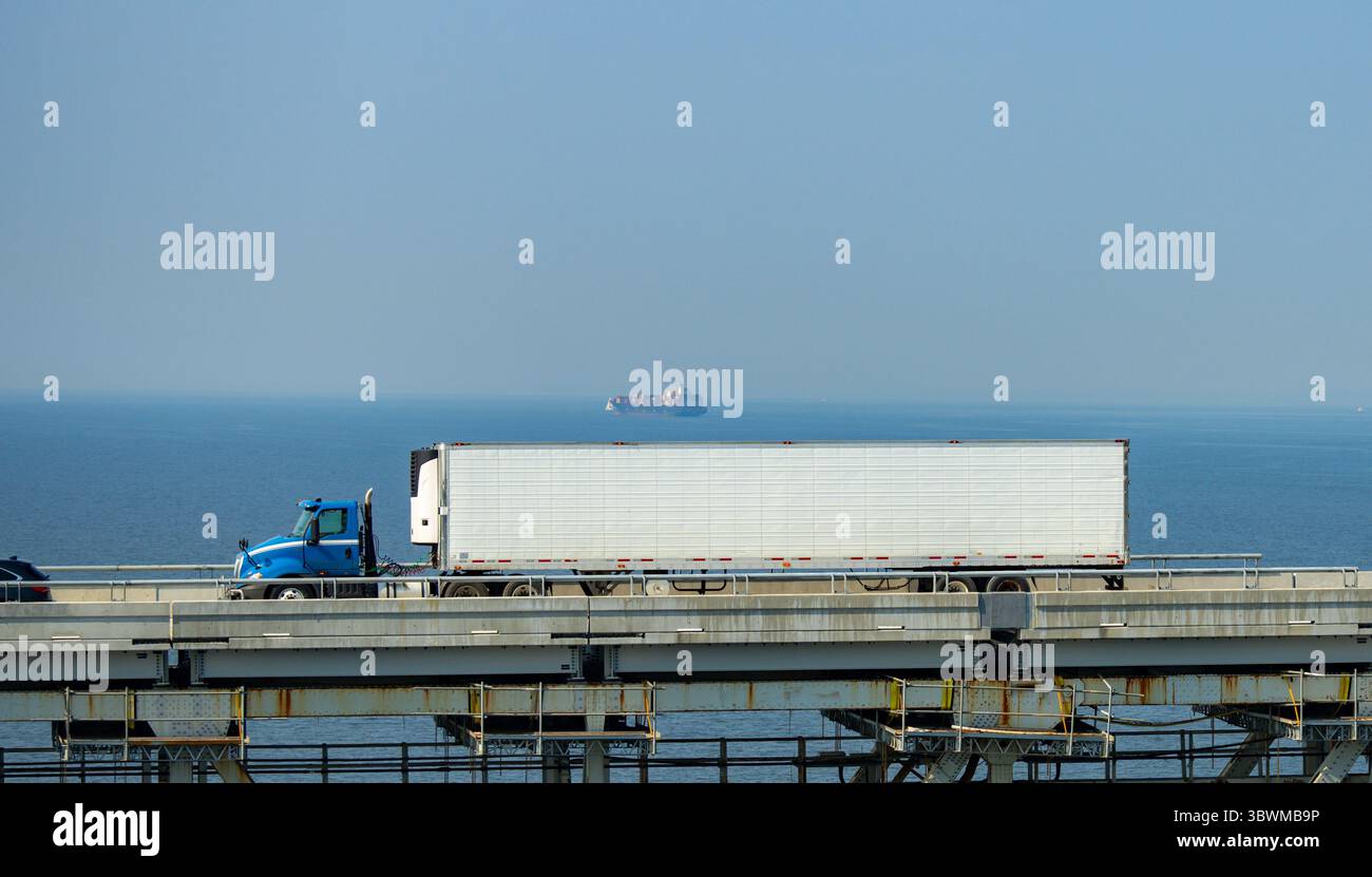 Truck driving across the bridge. Lorry transporting. Cargo trailer ...