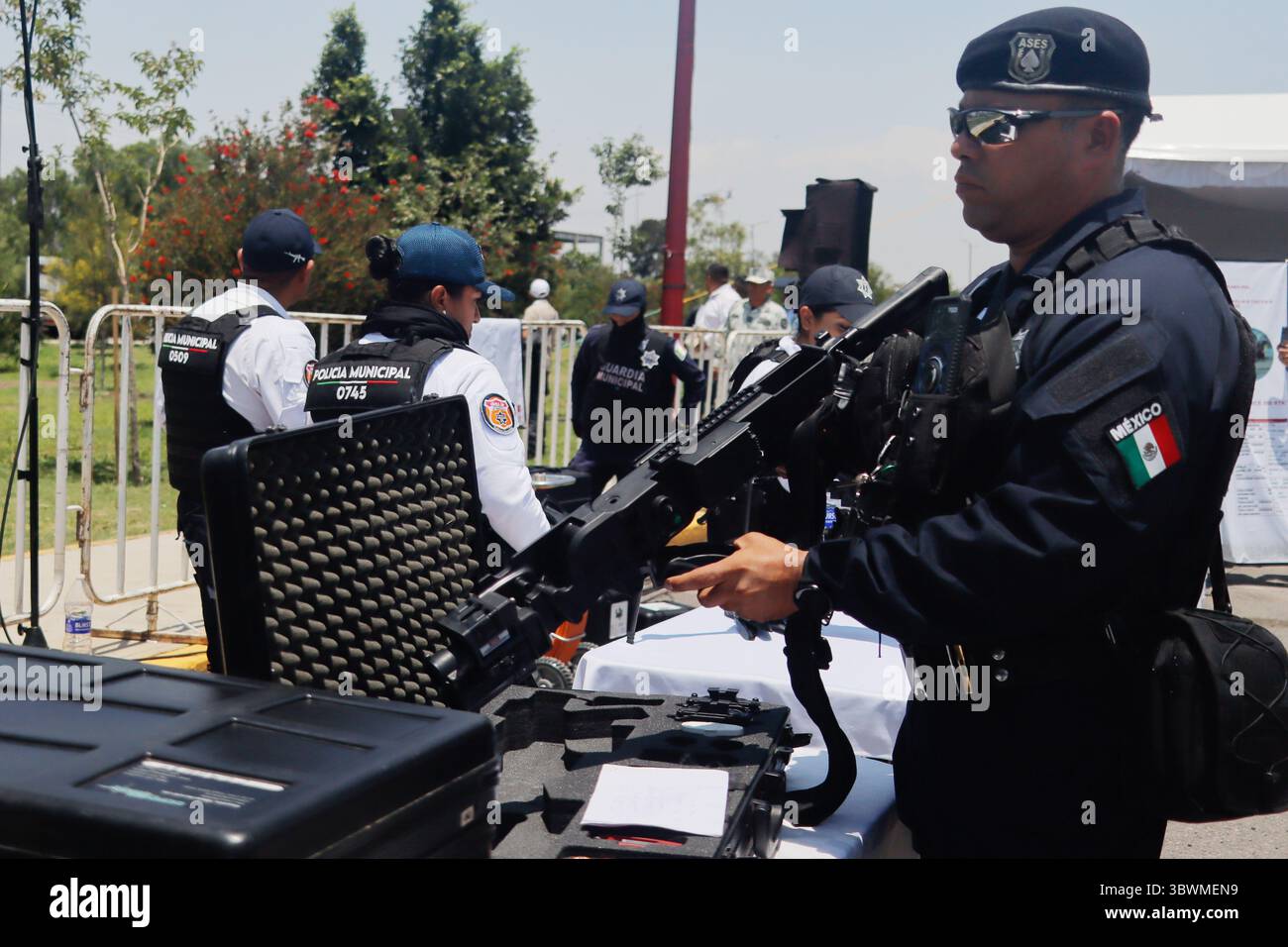 A member of the ASES grouping holds a high-powered machine gun during ...