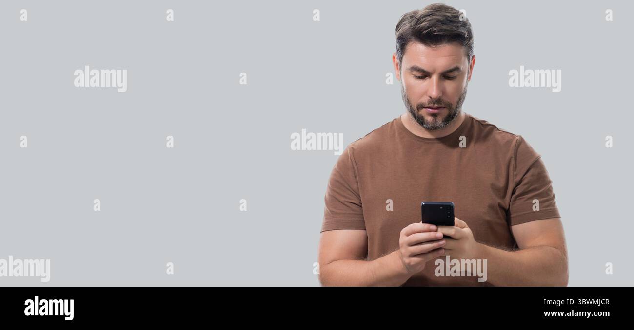 Business man watching on mobile phone. Handsome man using smart phone ...
