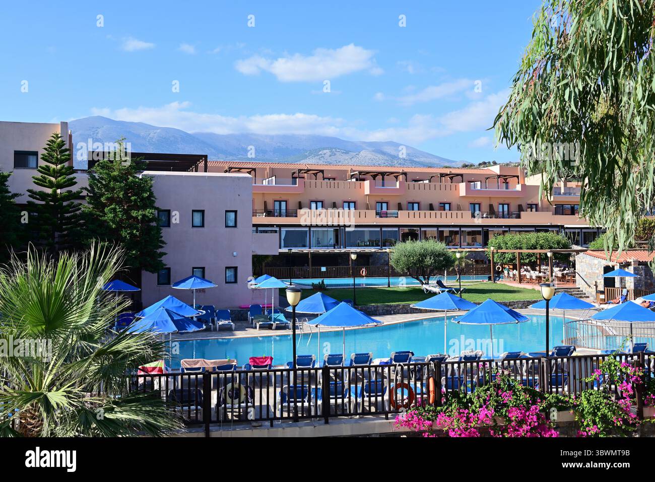 Hotel and plants in Sissi on Crete, Greece Stock Photo - Alamy