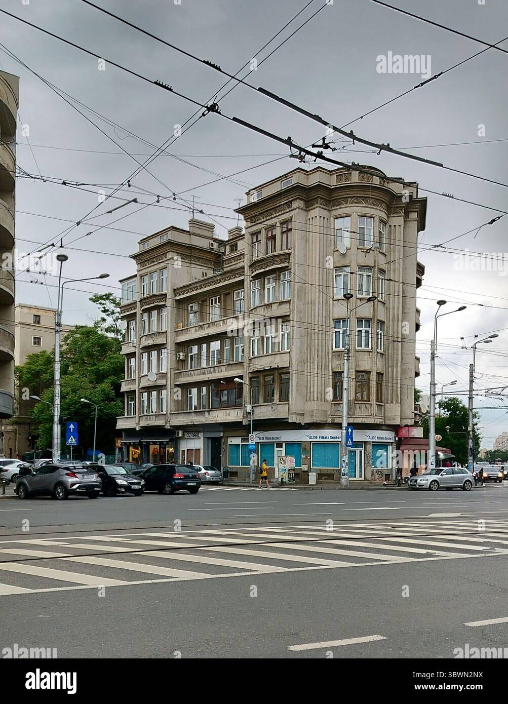 Urban scene with a busy intersection featuring early 20th-century ...